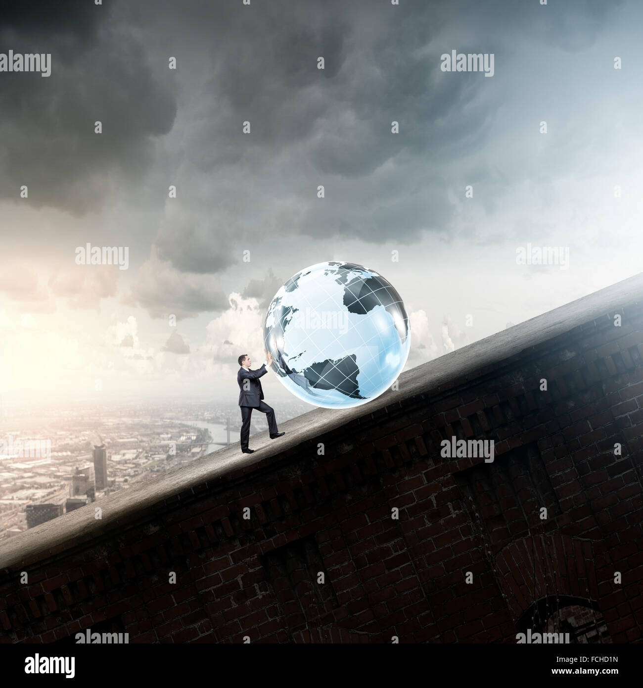 Businessman rolling Earth planet up the hill Stock Photo - Alamy