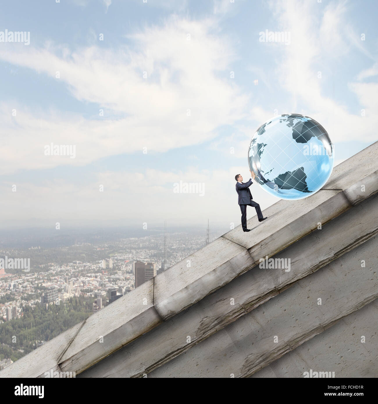 Businessman rolling Earth planet up the hill Stock Photo - Alamy