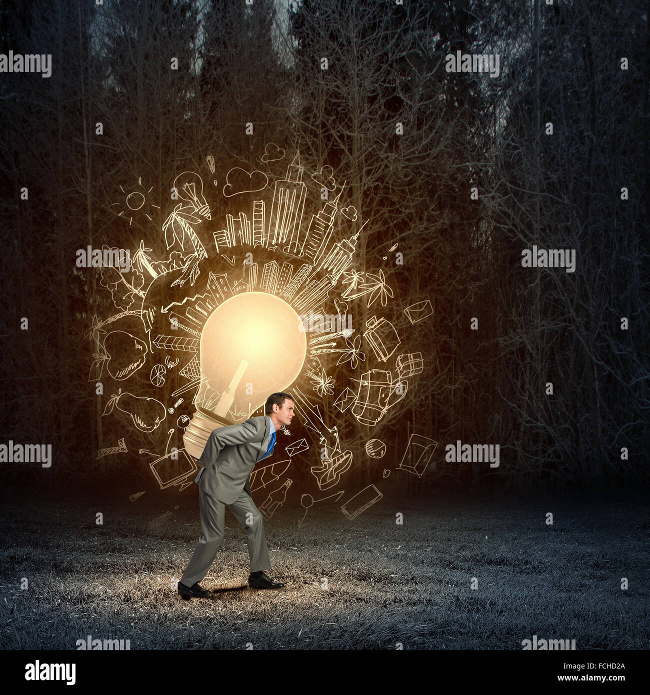 Tired businessman carrying light bulb on his back Stock Photo - Alamy