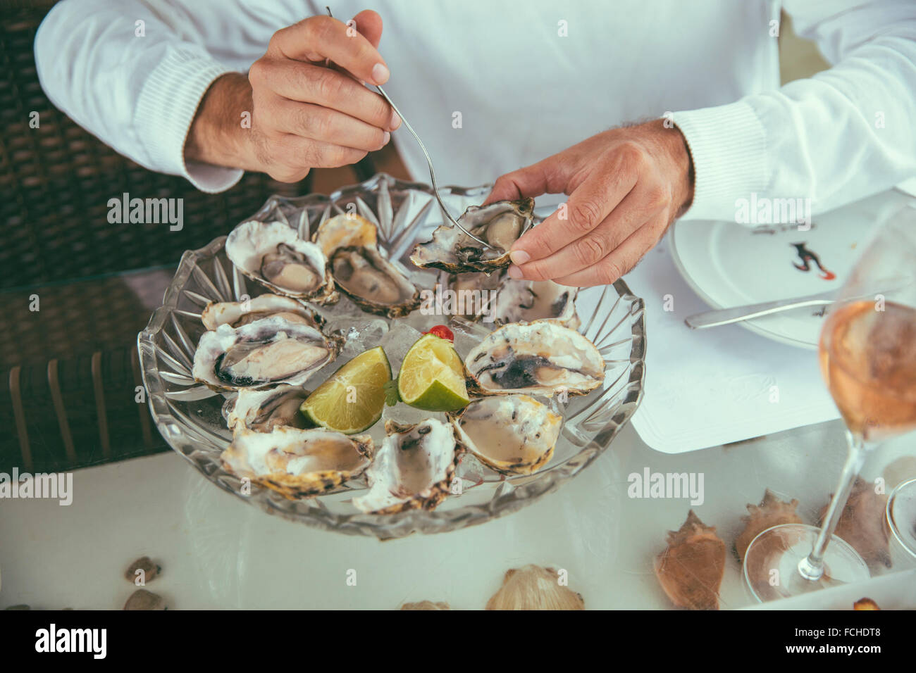 Man eating oysters not woman hi-res stock photography and images - Alamy