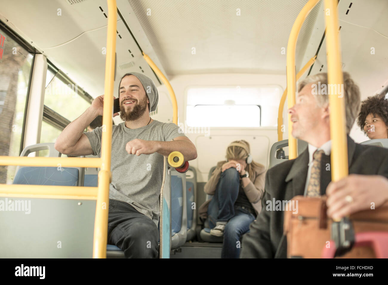People talking in city bus Stock Photo - Alamy
