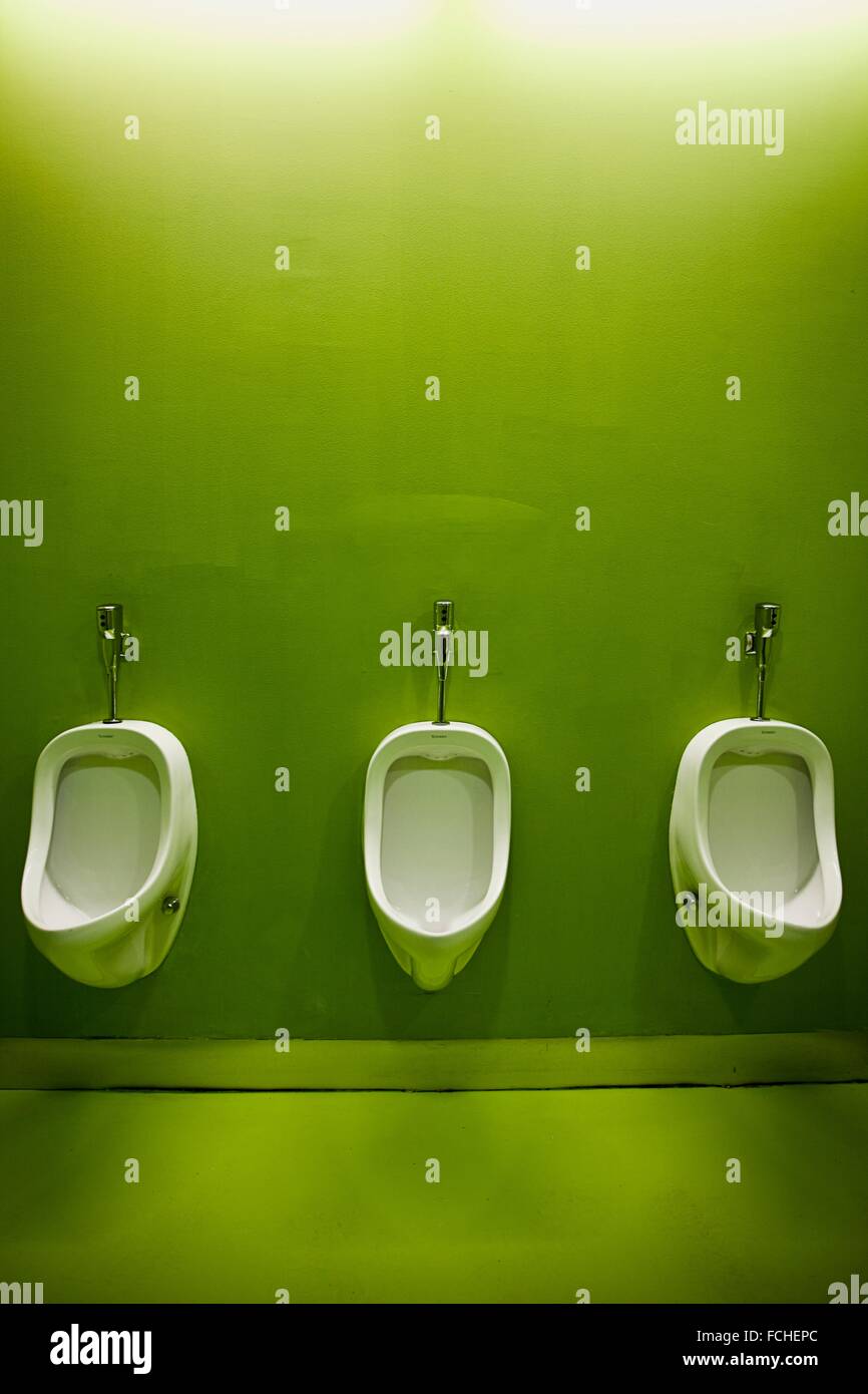 Three urinals hi-res stock photography and images - Alamy