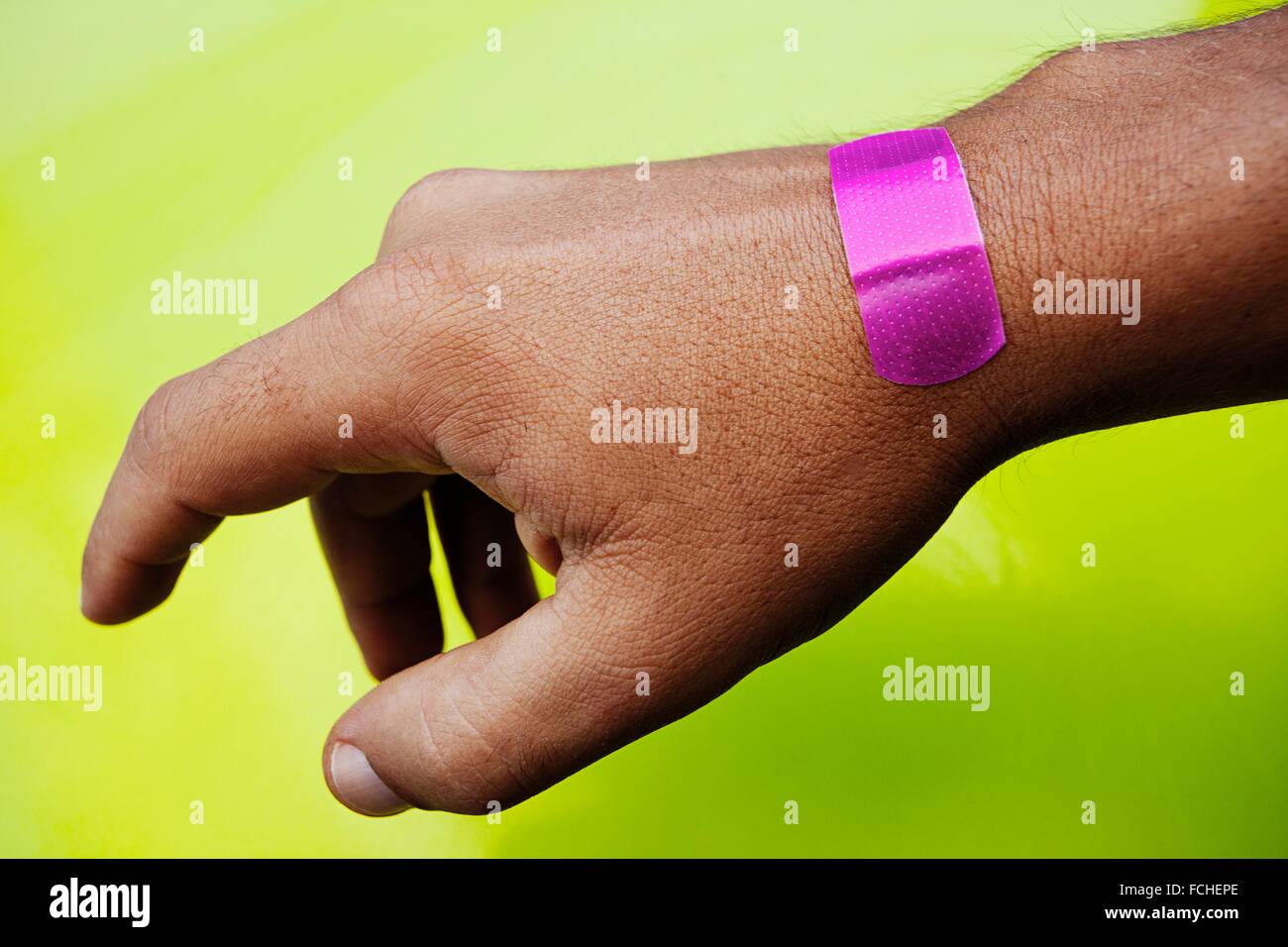 Bandaid on a hand Stock Photo - Alamy