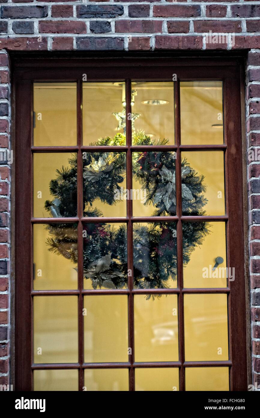 Christmas Wreath, Backlit in a showcase, mulit-paned window, New York ...