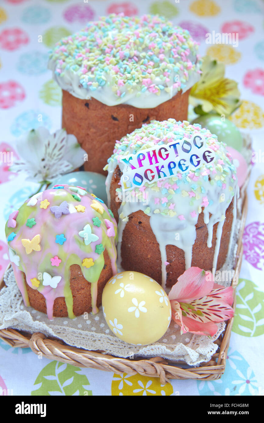 Easter cake with glace icing and colored easter eggs Stock Photo - Alamy