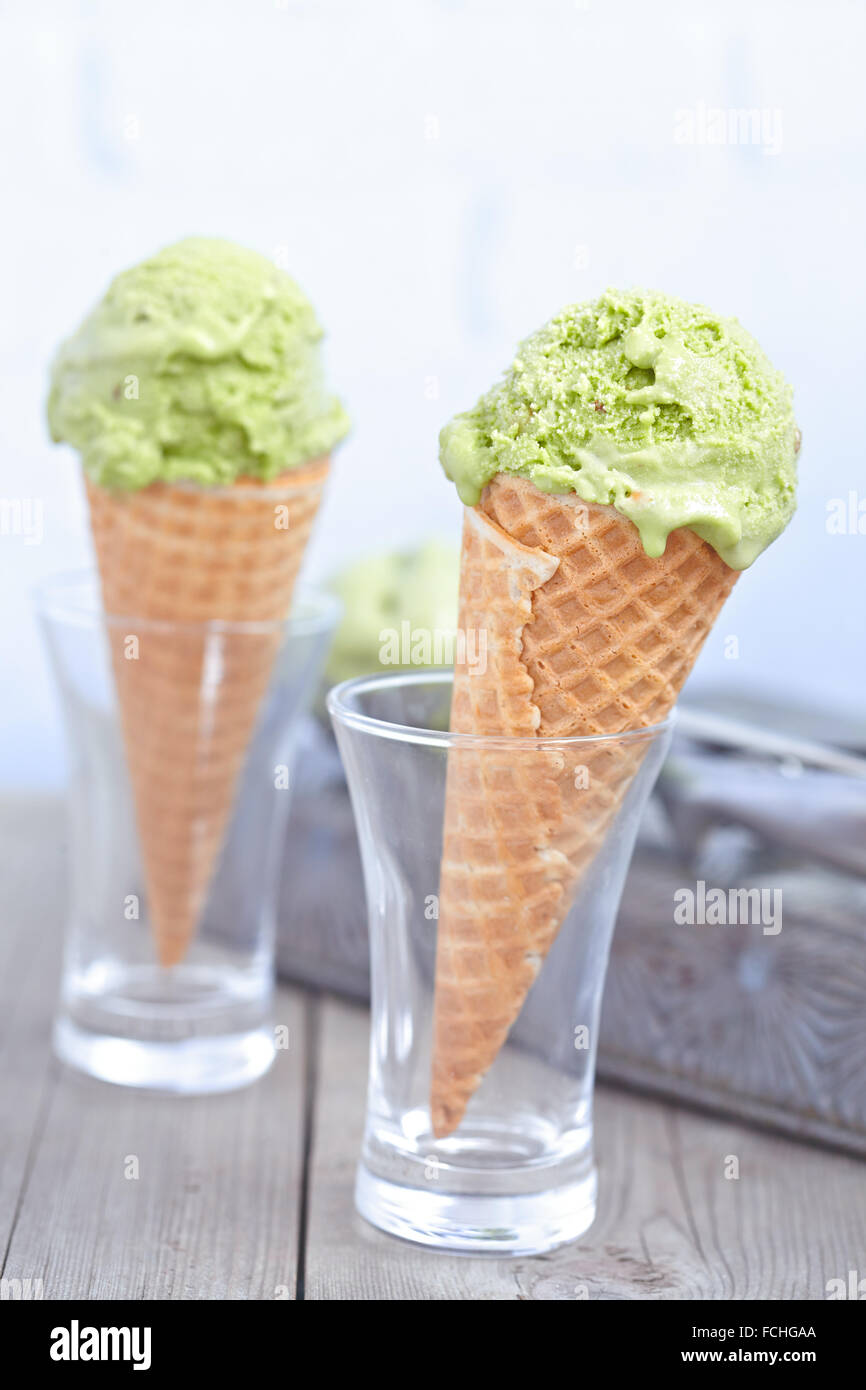 Green matcha ice cream with almond nuts Stock Photo - Alamy