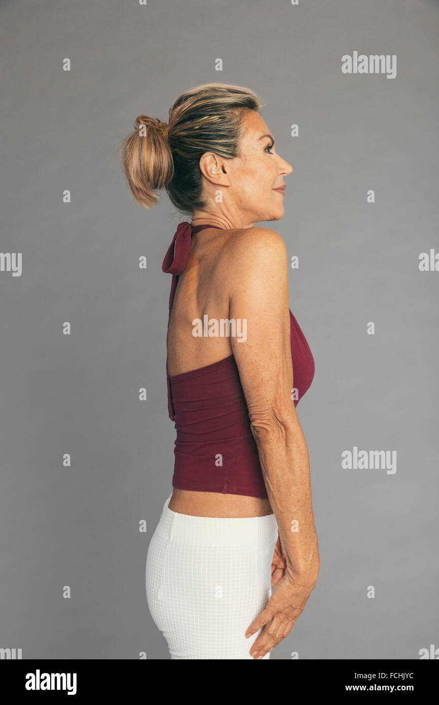 Mature woman shoulders circles exercise Stock Photo - Alamy