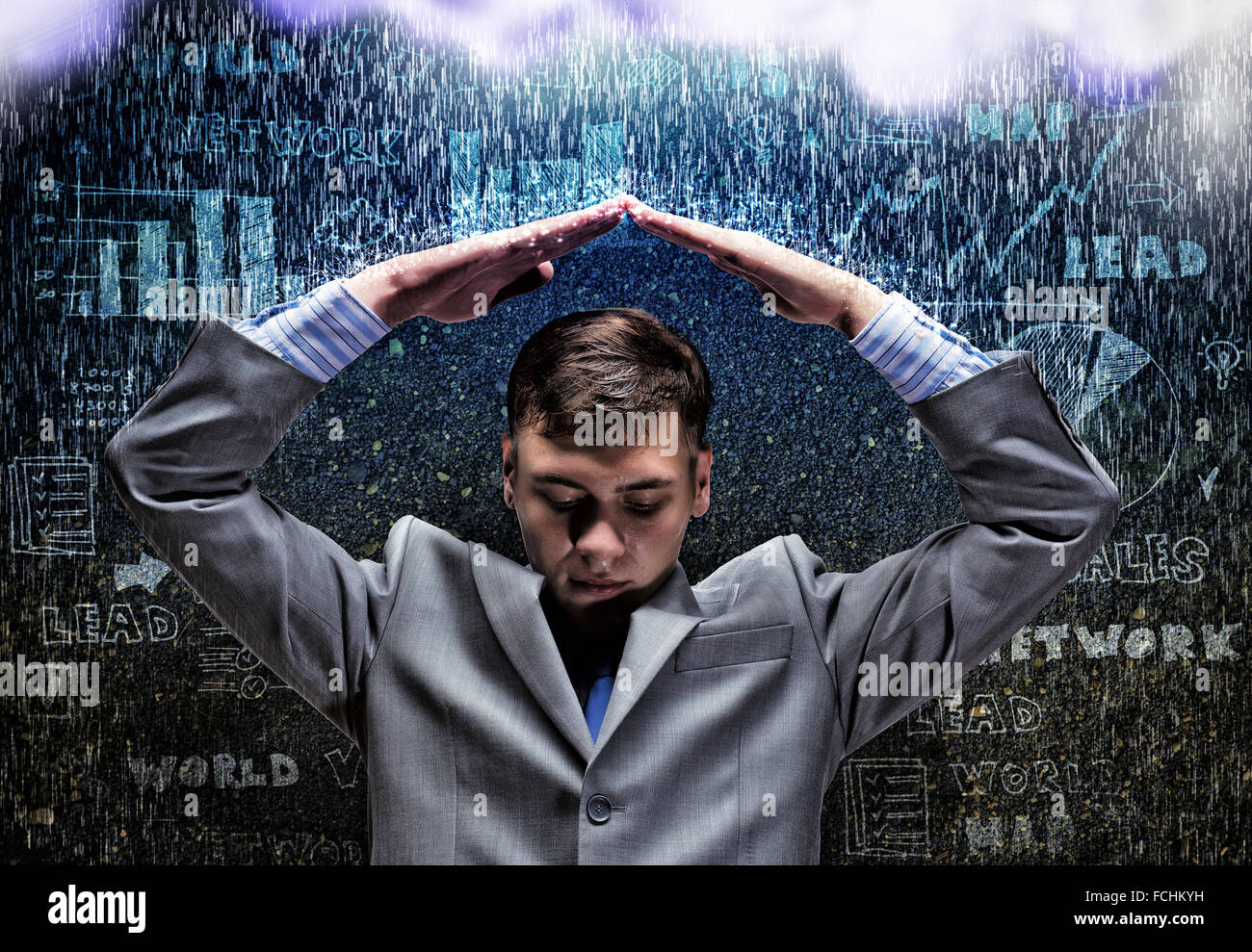 Young businessman under rain covering head with hands Stock Photo - Alamy