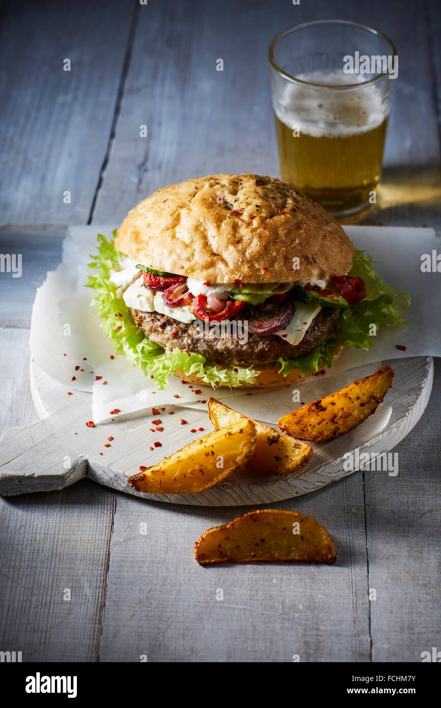 Cheeseburger and potato wedges Stock Photo - Alamy