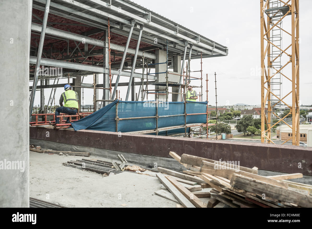 Two construction workers on construction site Stock Photo - Alamy
