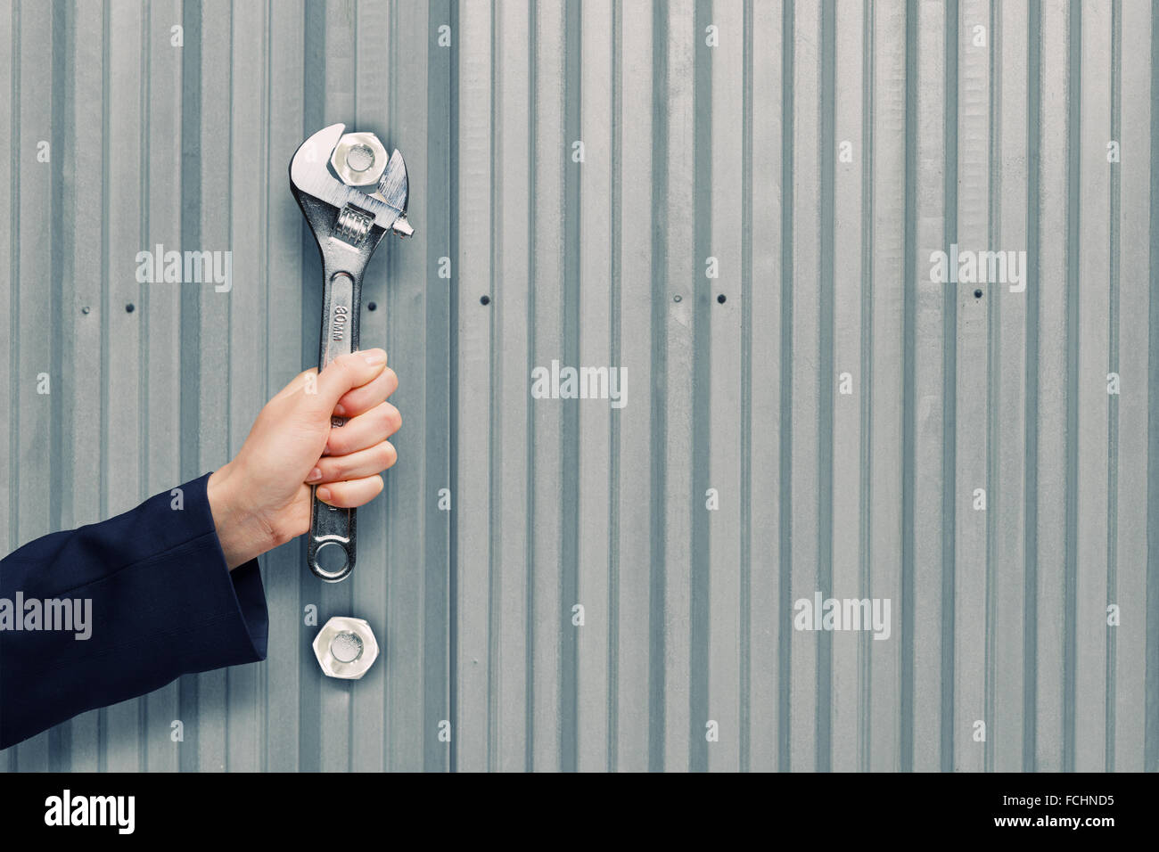 Close up of businessman hand fixing mechanism with spanner Stock Photo ...