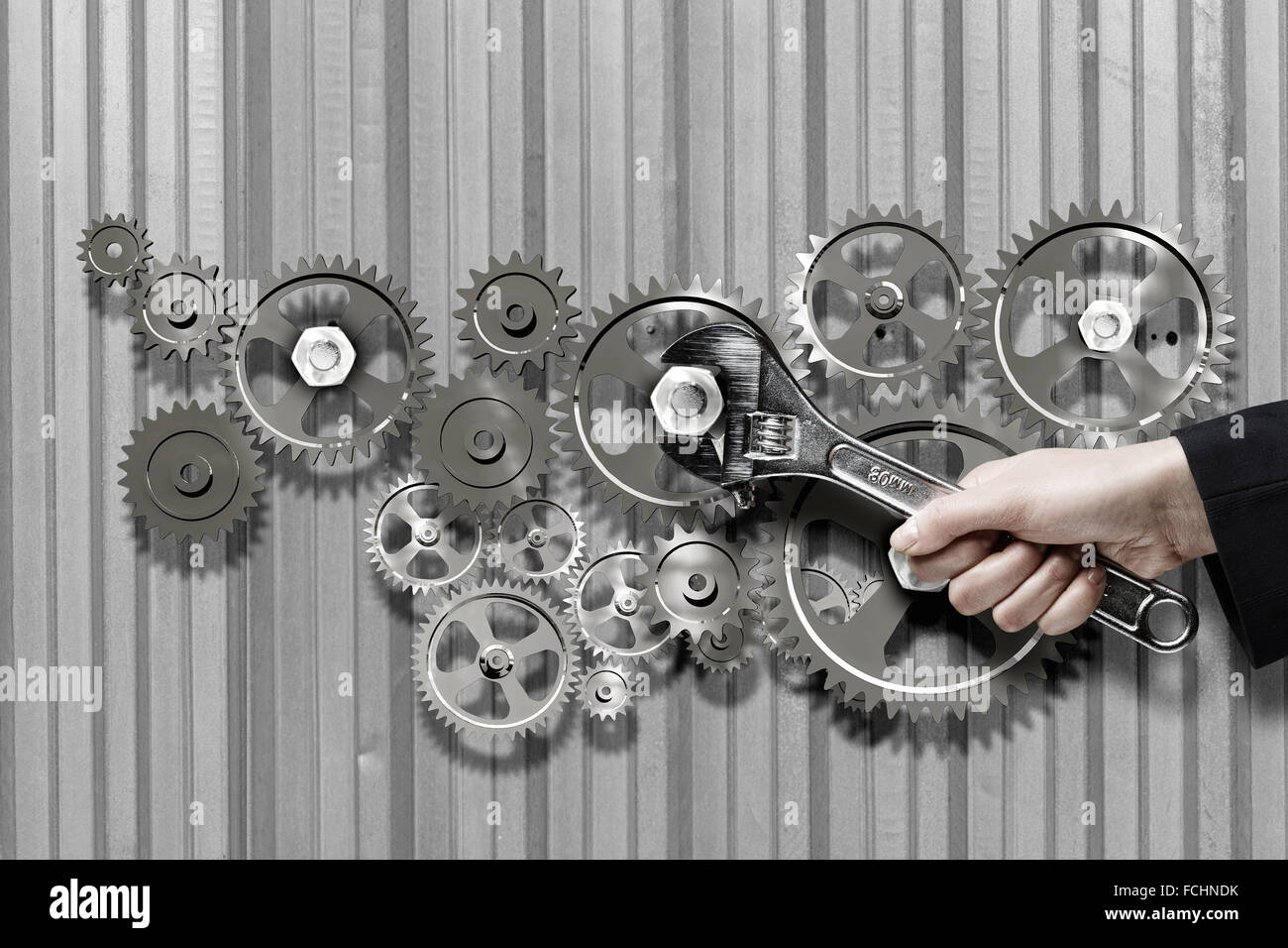 Close up of businessman hand fixing mechanism with spanner Stock Photo ...
