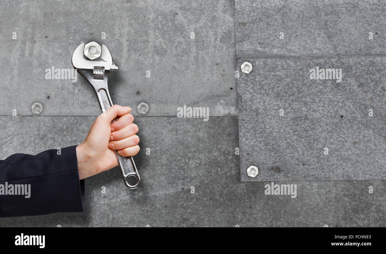 Close up of businessman hand fixing mechanism with spanner Stock Photo ...