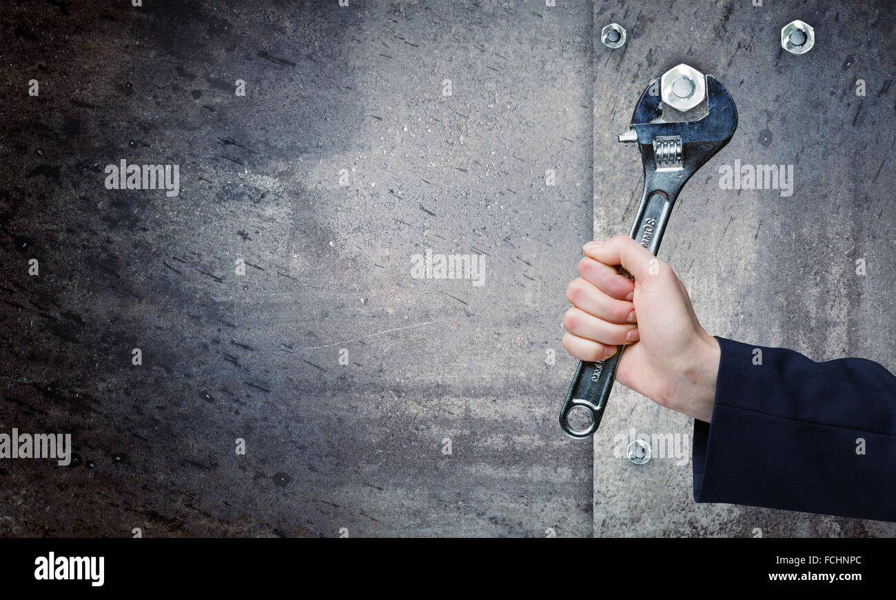 Close up of businessman hand fixing mechanism with spanner Stock Photo ...
