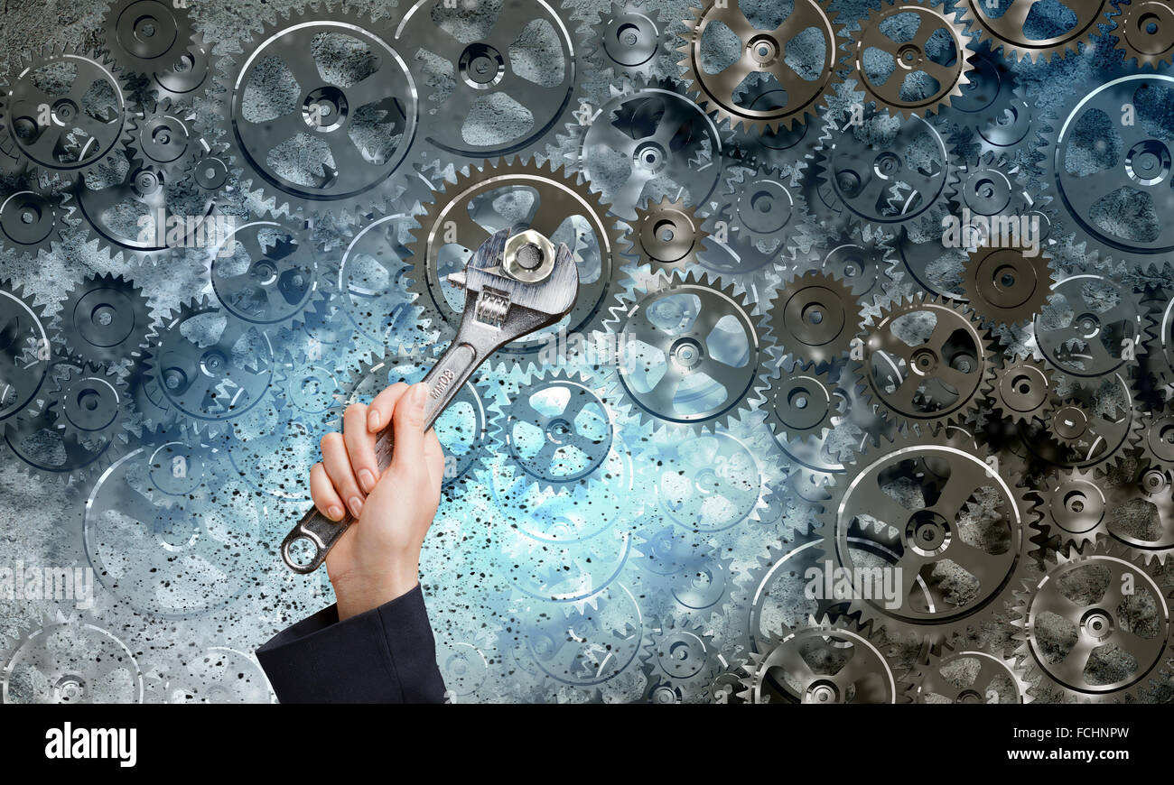 Close up of businessman hand fixing mechanism with spanner Stock Photo ...