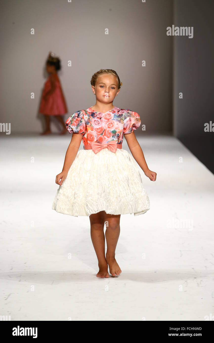A kid model walks the runway at the Nancy Vuu fashion show during ...