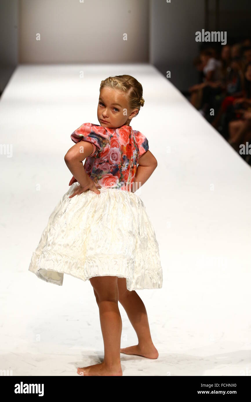 A kid model walks the runway at the Nancy Vuu fashion show during ...