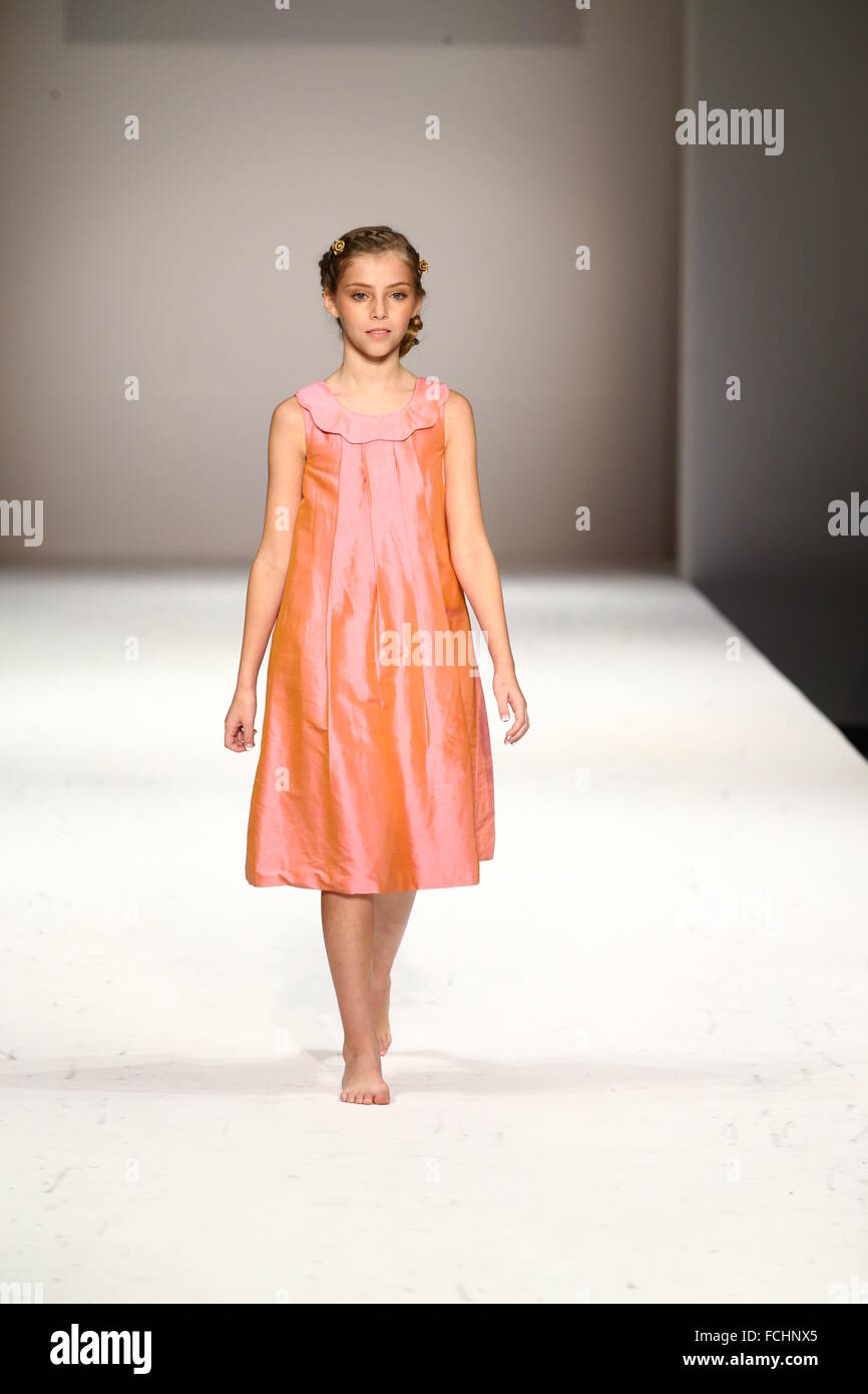A kid model walks the runway at the Nancy Vuu fashion show during ...