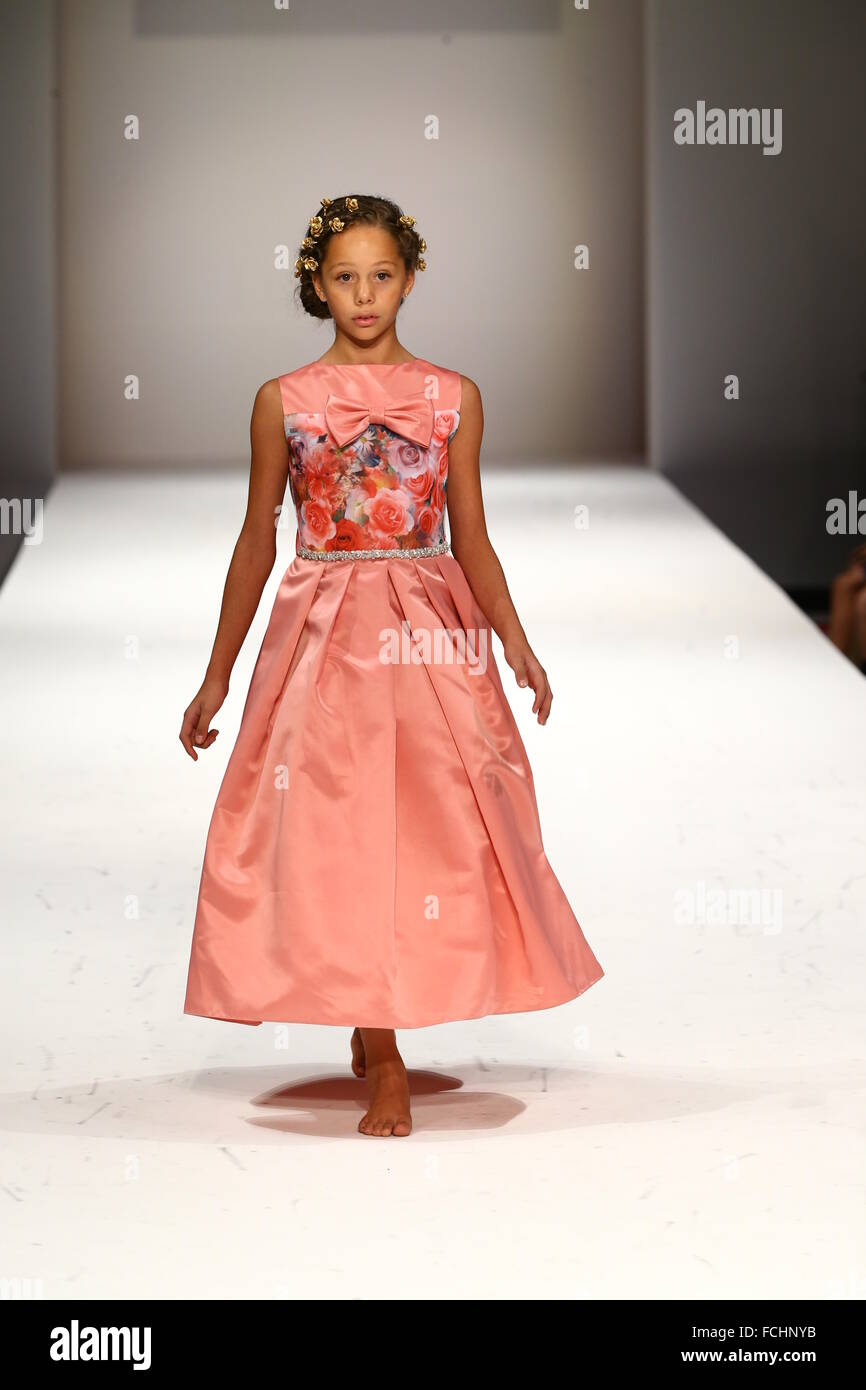 A kid model walks the runway at the Nancy Vuu fashion show during ...