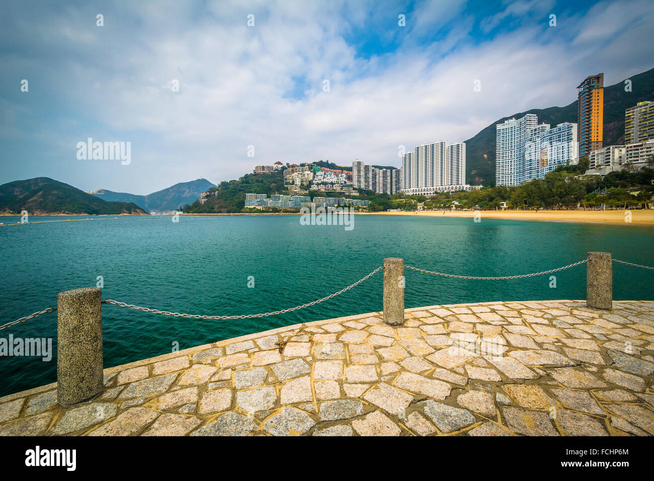 View of skyscrapers and beach from a pier at Repulse Bay, in Hong Kong ...