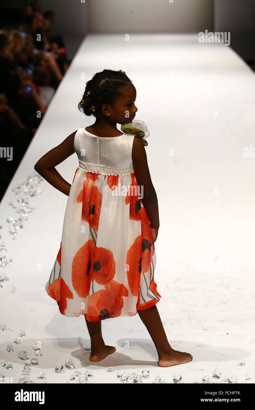 A kid model walks the runway at the Nancy Vuu fashion show during ...
