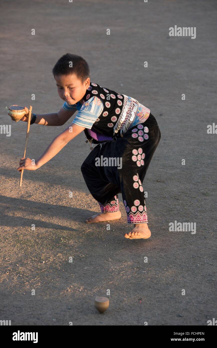 Hmong boy and his wooden top in Mon Jam, Chiang Mai, Thailand Stock ...
