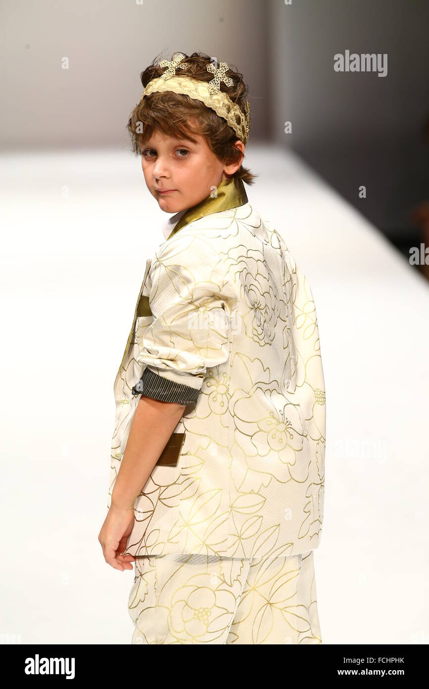A kid model walks the runway at the Nancy Vuu fashion show during ...