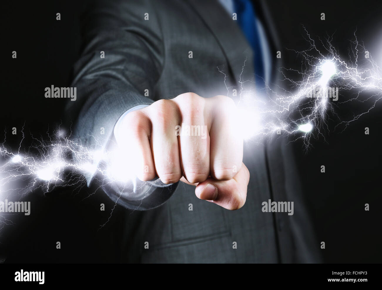 Businessman holding lightning in fist hi-res stock photography and ...