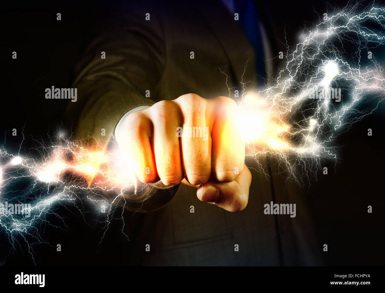 Businessman holding lightning in fist hi-res stock photography and ...