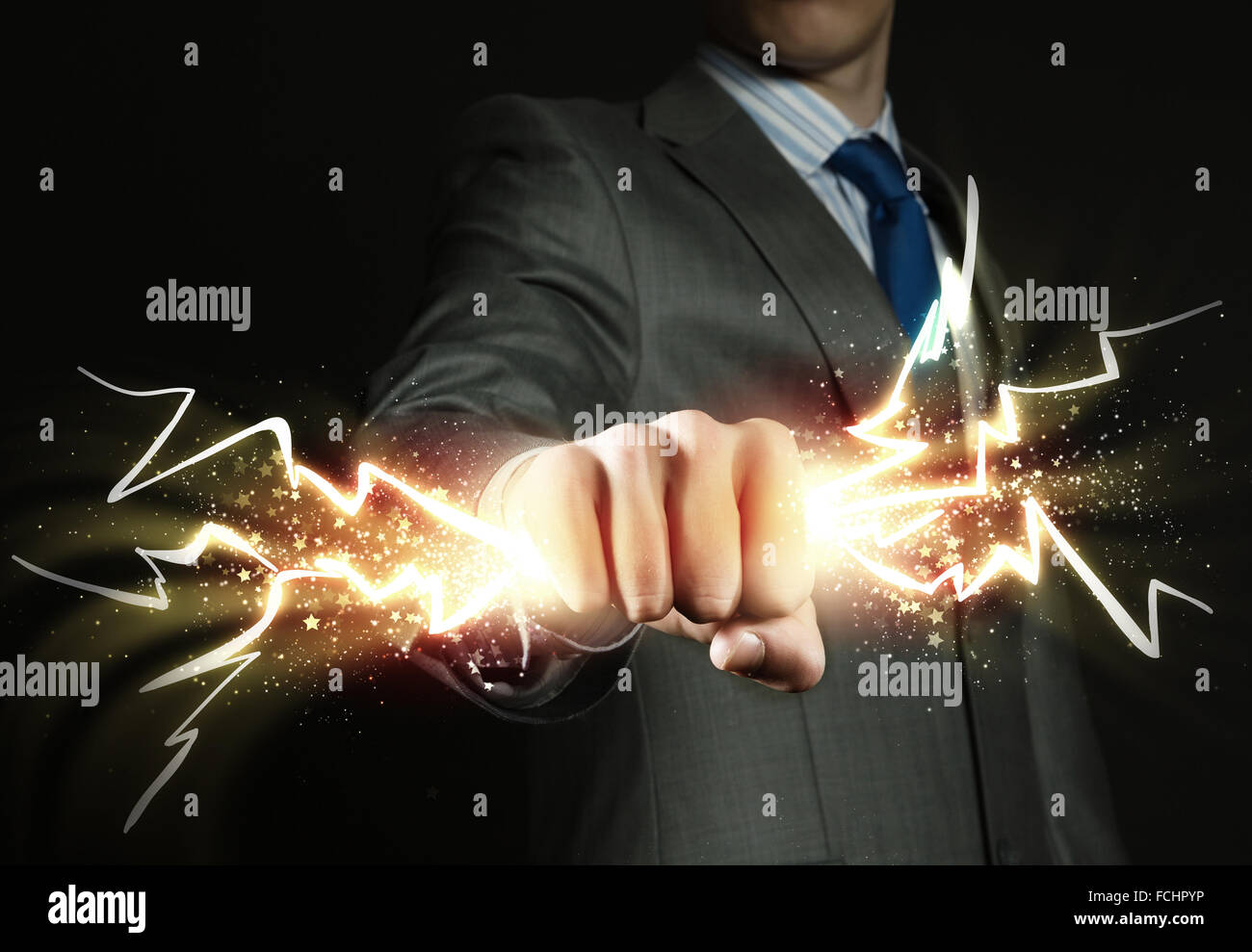 Close up of businessman hand holding lightning in fist Stock Photo - Alamy