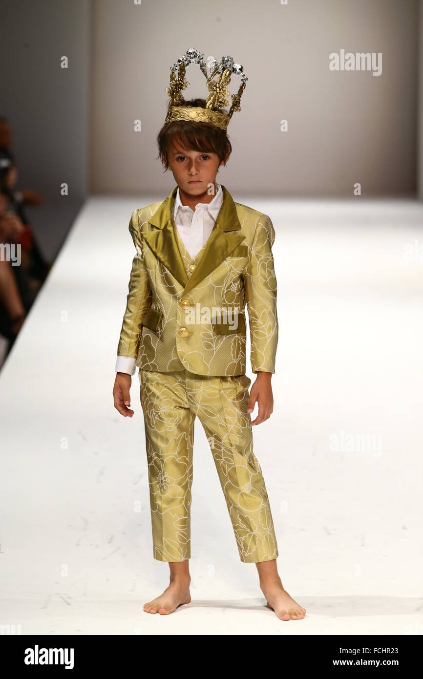 A kid model walks the runway at the Nancy Vuu fashion show during ...