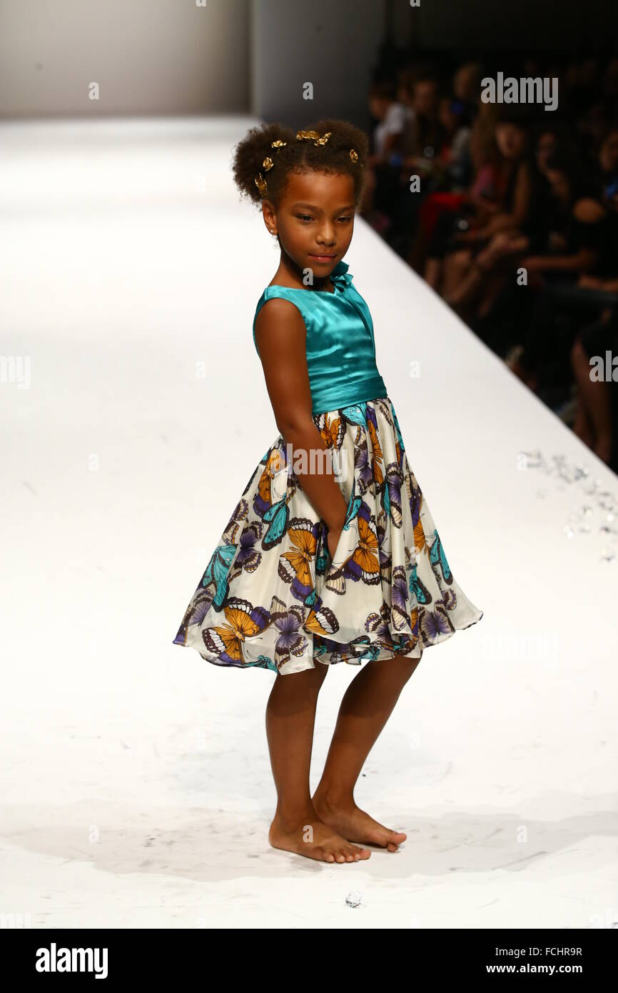 A kid model walks the runway at the Nancy Vuu fashion show during ...
