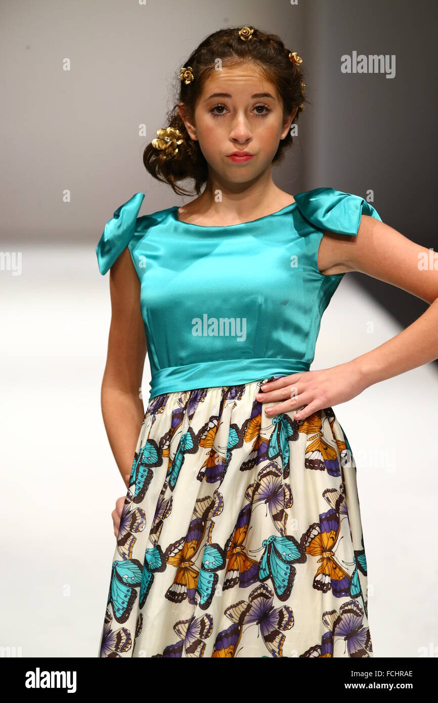 A kid model walks the runway at the Nancy Vuu fashion show during ...