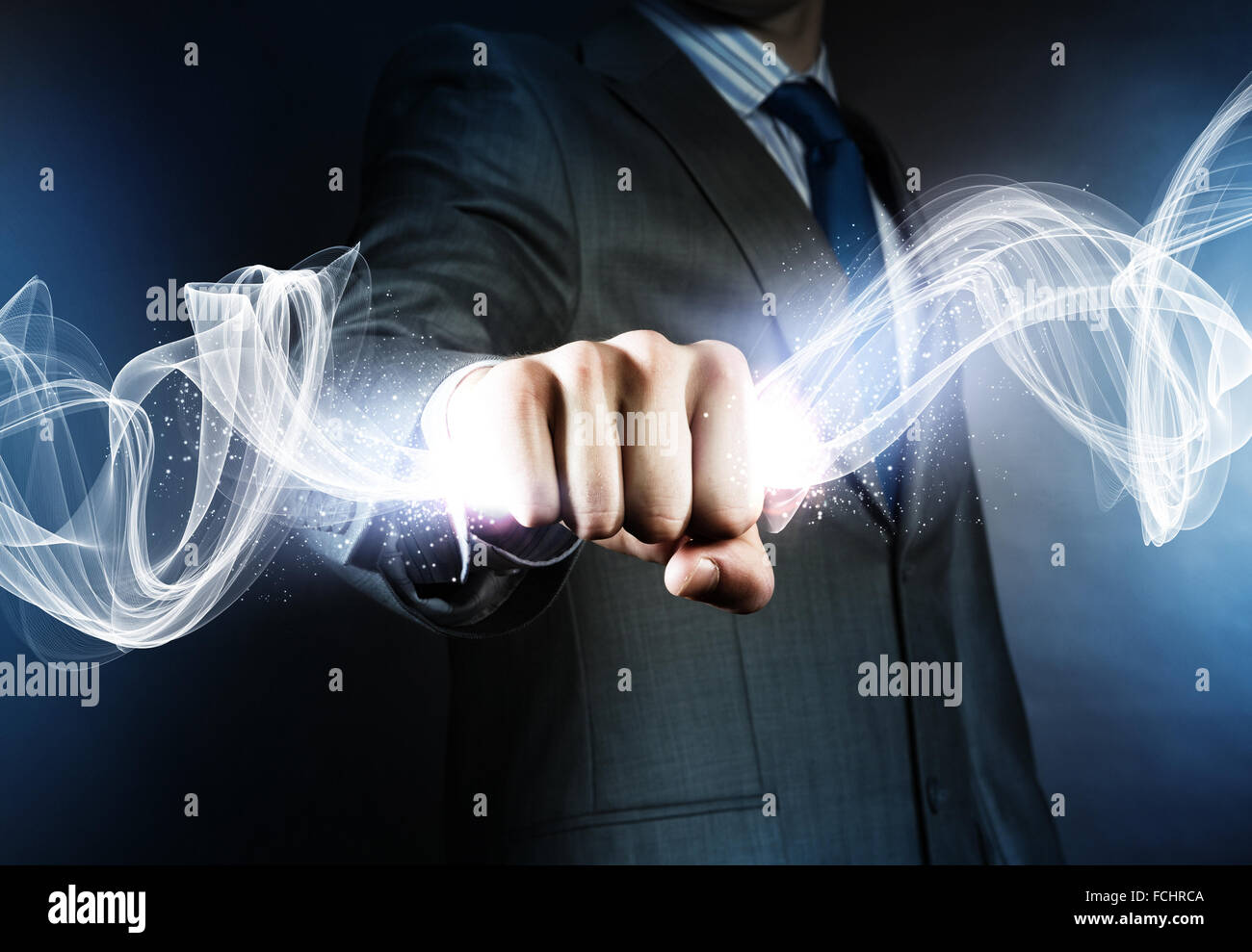 Businessman holding lightning in fist hi-res stock photography and ...