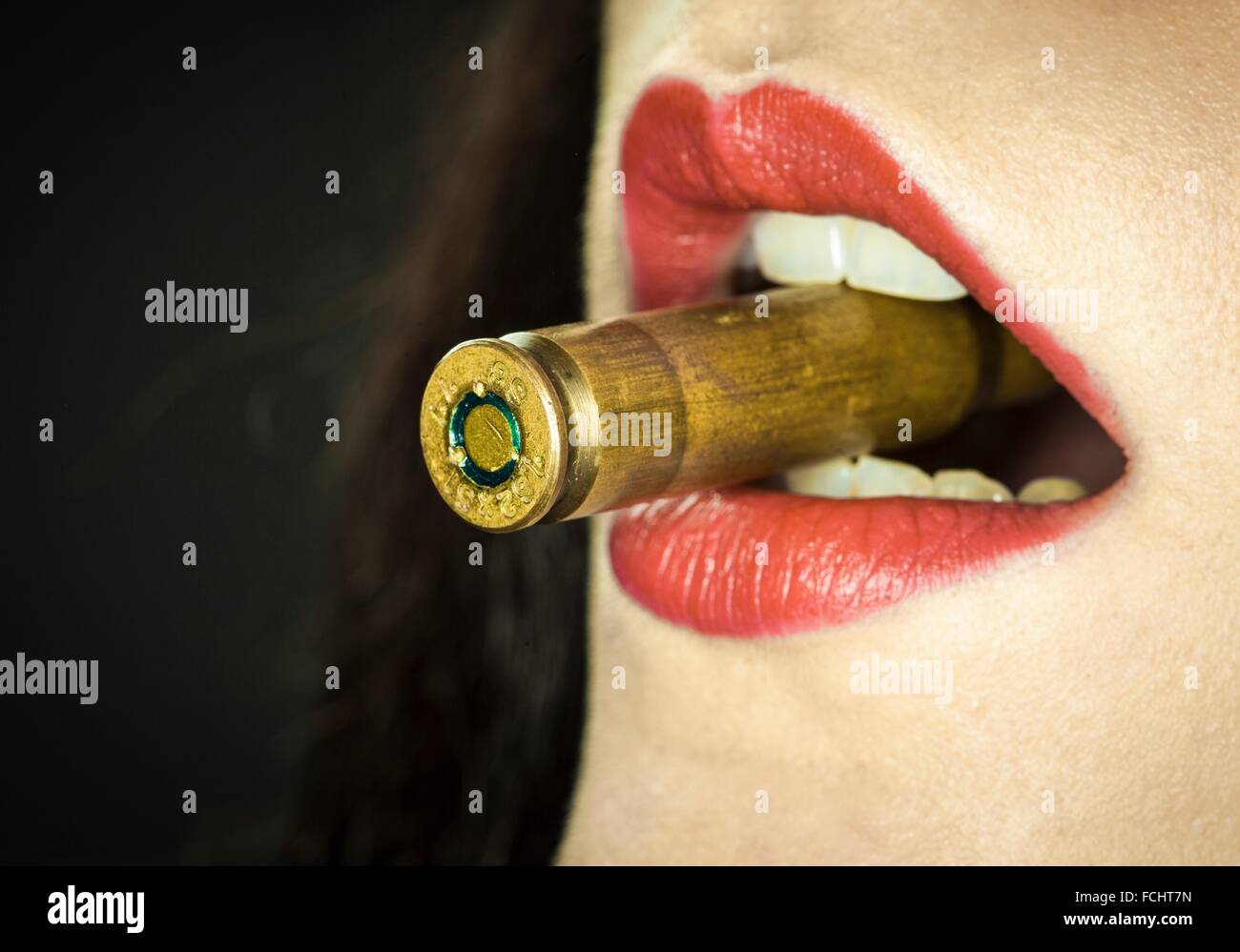 Biting the bullet hi-res stock photography and images - Alamy