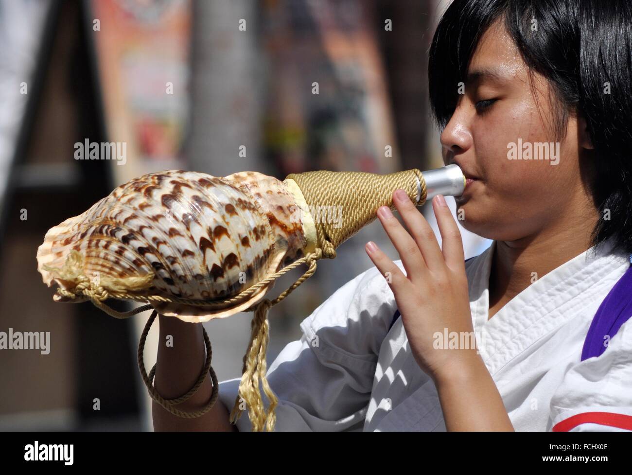 Blowing into a shell hi-res stock photography and images - Alamy