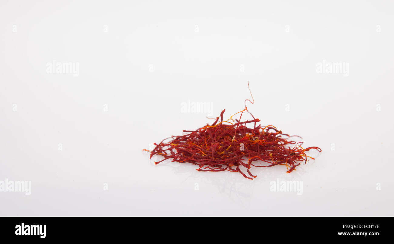 Handful of Spanish Saffron Isolated on white background Stock Photo - Alamy
