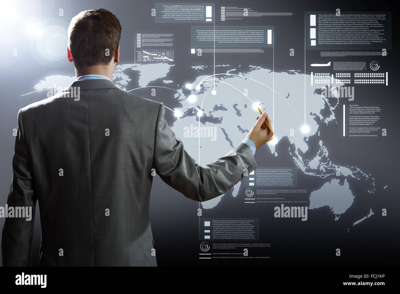 Rear view of businessman touching digital screen Stock Photo - Alamy