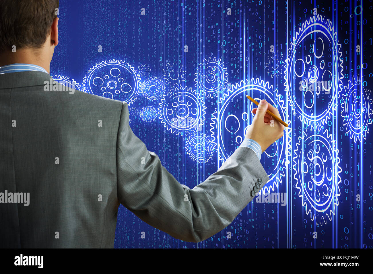 Rear view of businessman touching digital screen Stock Photo - Alamy Rear view of businessman touching digital screen Stock Photo - Alamy