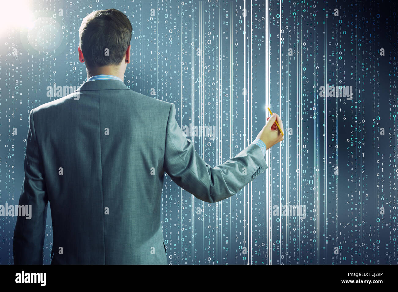 Rear view of businessman touching digital screen Stock Photo - Alamy Rear view of businessman touching digital screen Stock Photo - Alamy