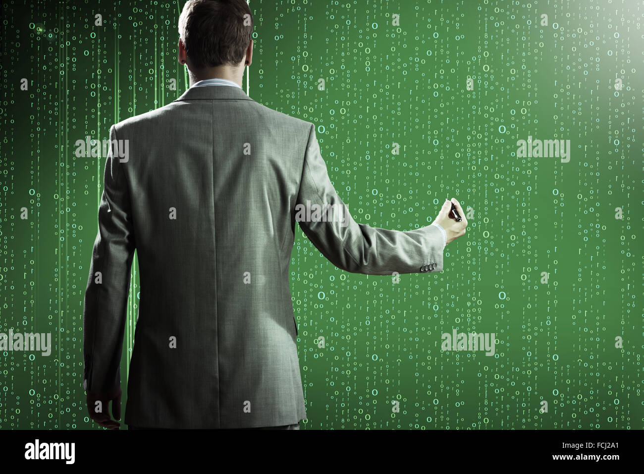 Rear view of businessman touching digital screen Stock Photo - Alamy Rear view of businessman touching digital screen Stock Photo - Alamy