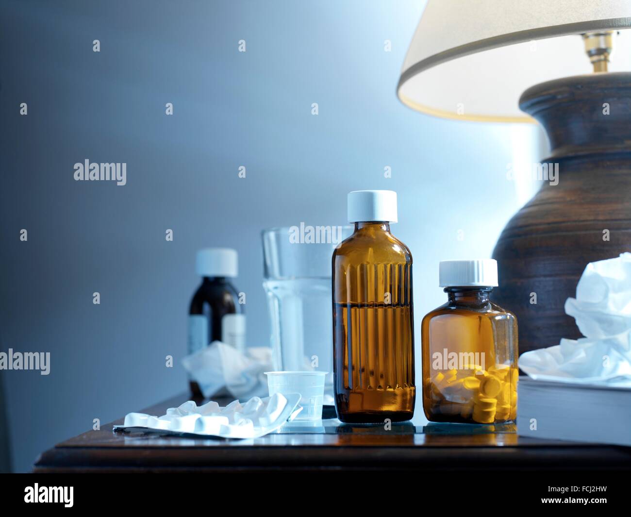 Medicine on bed side table Stock Photo - Alamy