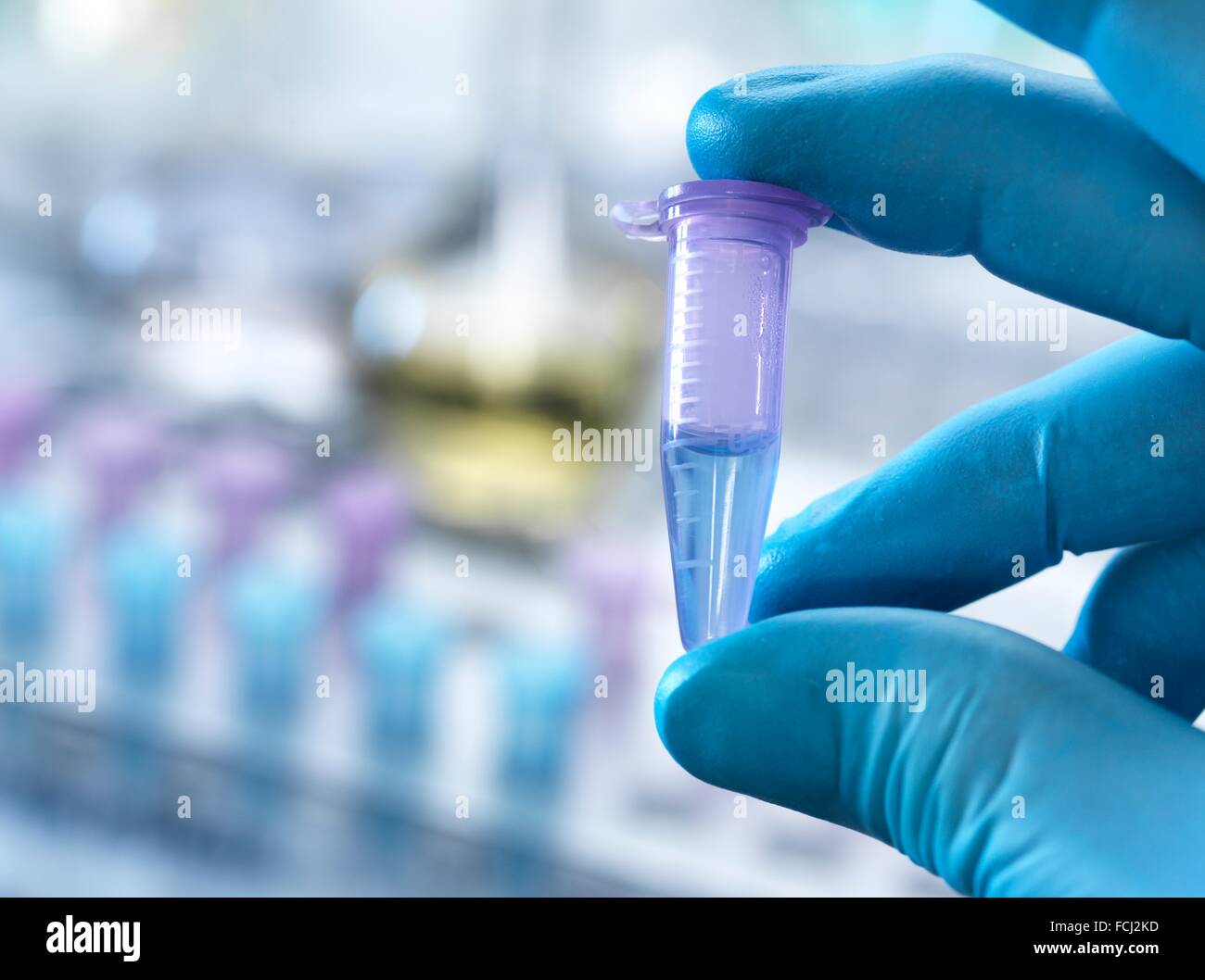 PROPERTY RELEASED. Scientist preparing a sample in a eppendorf tube for ...