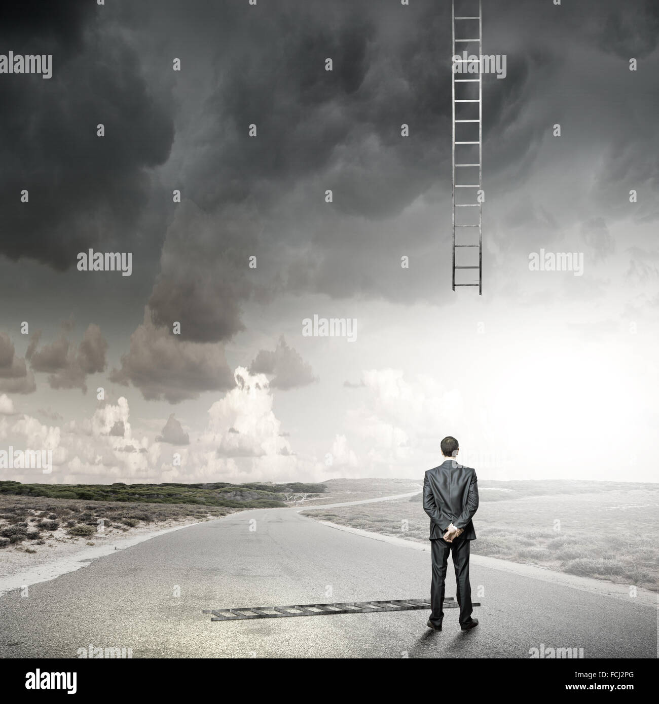 Rear view of businessman and broken ladder going up Stock Photo - Alamy