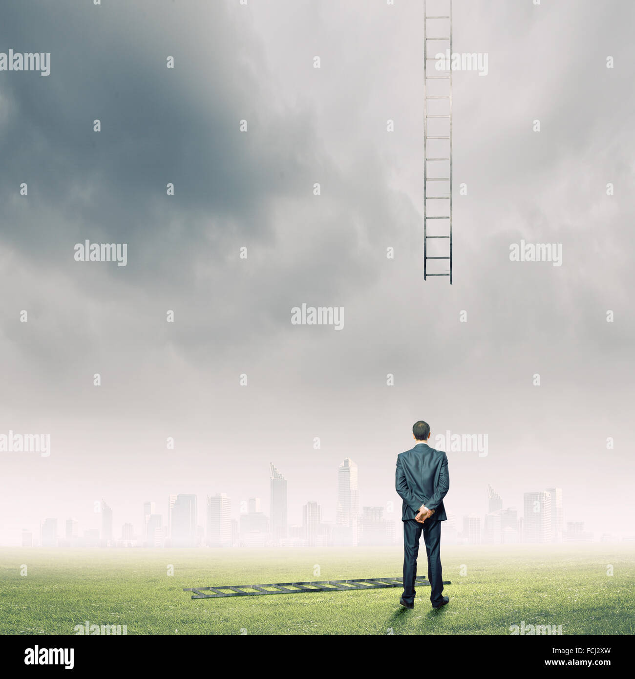 Rear view of businessman and broken ladder going up Stock Photo - Alamy