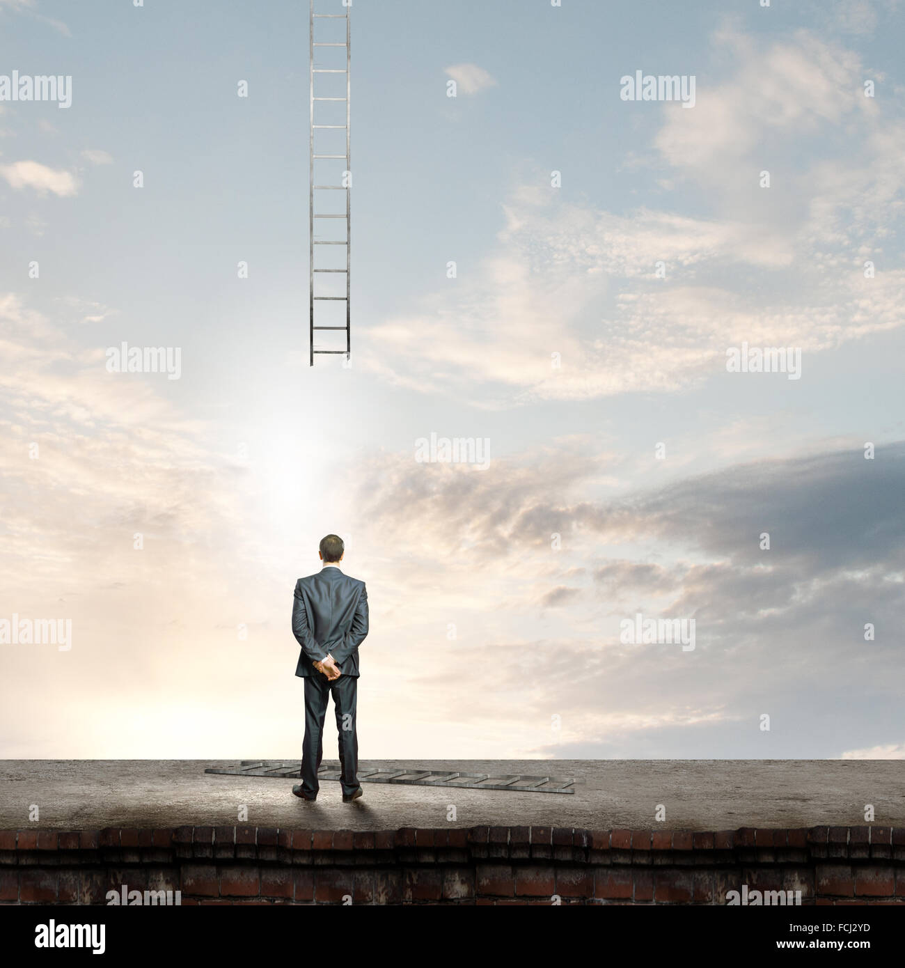 Rear view of businessman and broken ladder going up Stock Photo - Alamy