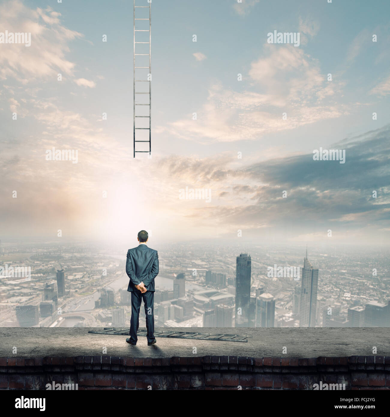 Rear view of businessman and broken ladder going up Stock Photo - Alamy