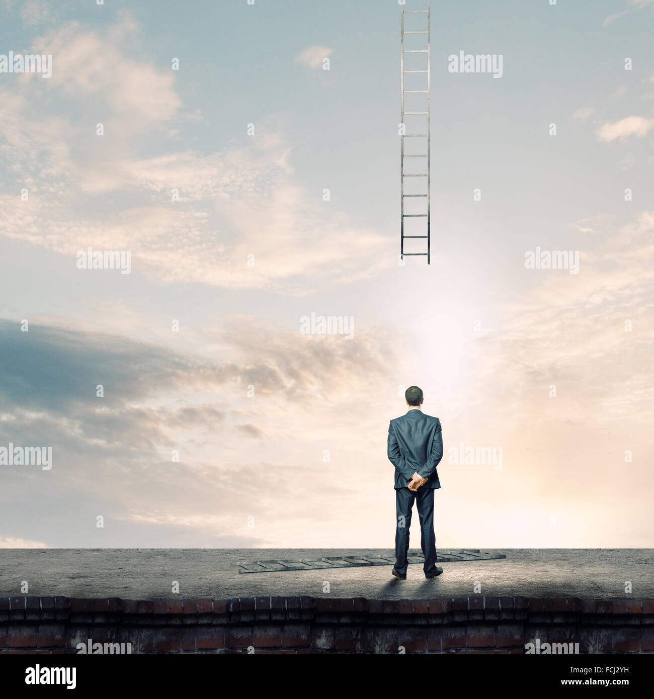 Rear view of businessman and broken ladder going up Stock Photo - Alamy