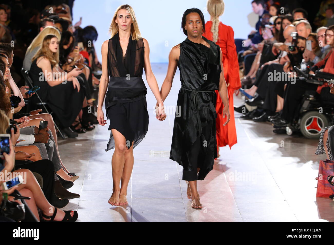 Two models walk runway during hi-res stock photography and images - Alamy