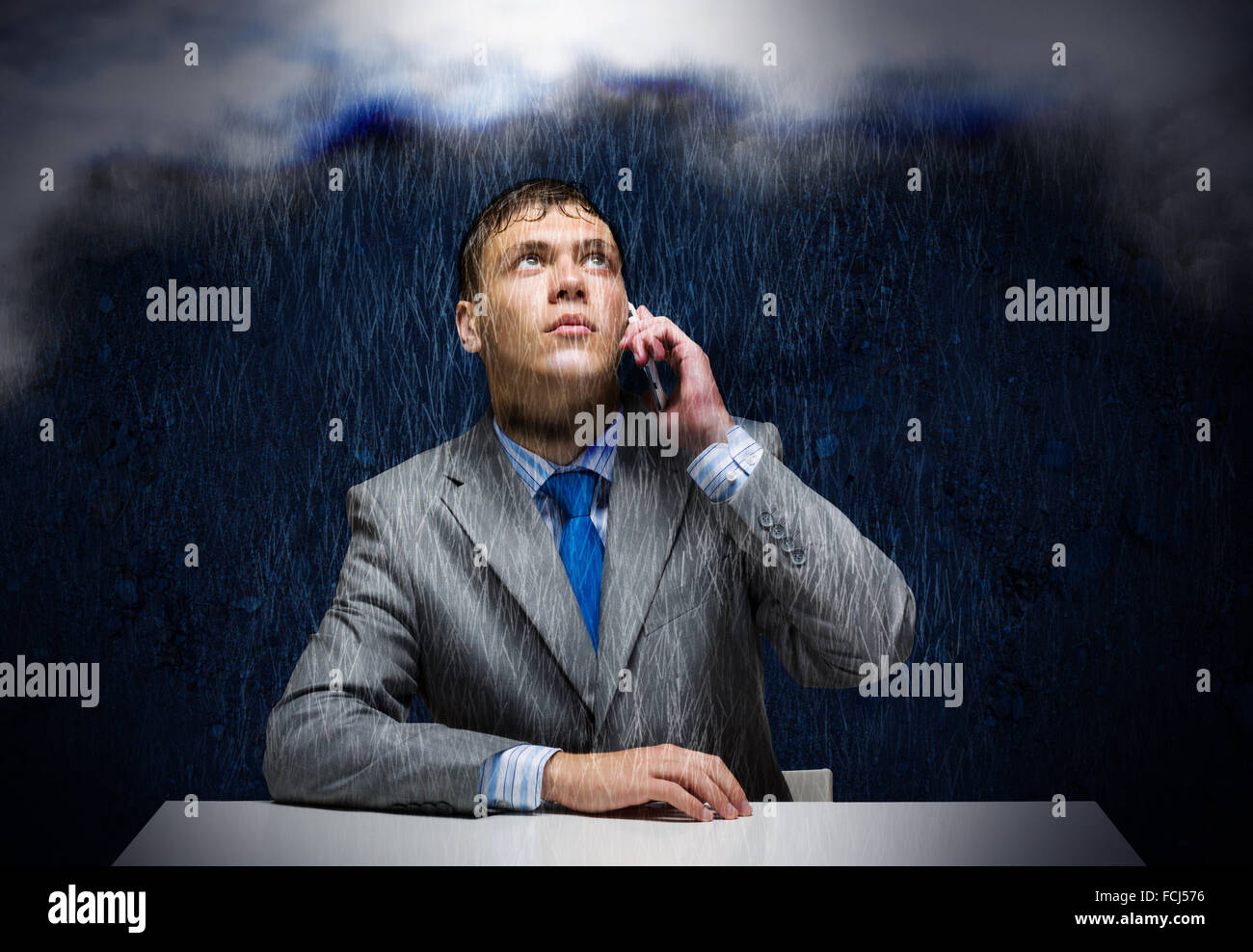 Young troubled wet businessman talking on phone Stock Photo - Alamy